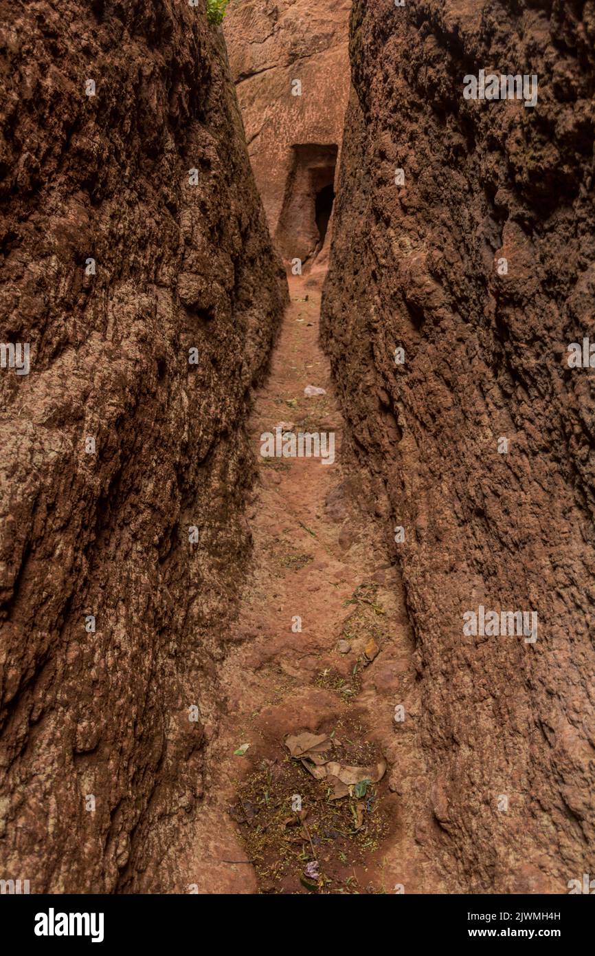 Narrow passage between rock-hewn churches in Lalibela, Ethiopia Stock ...