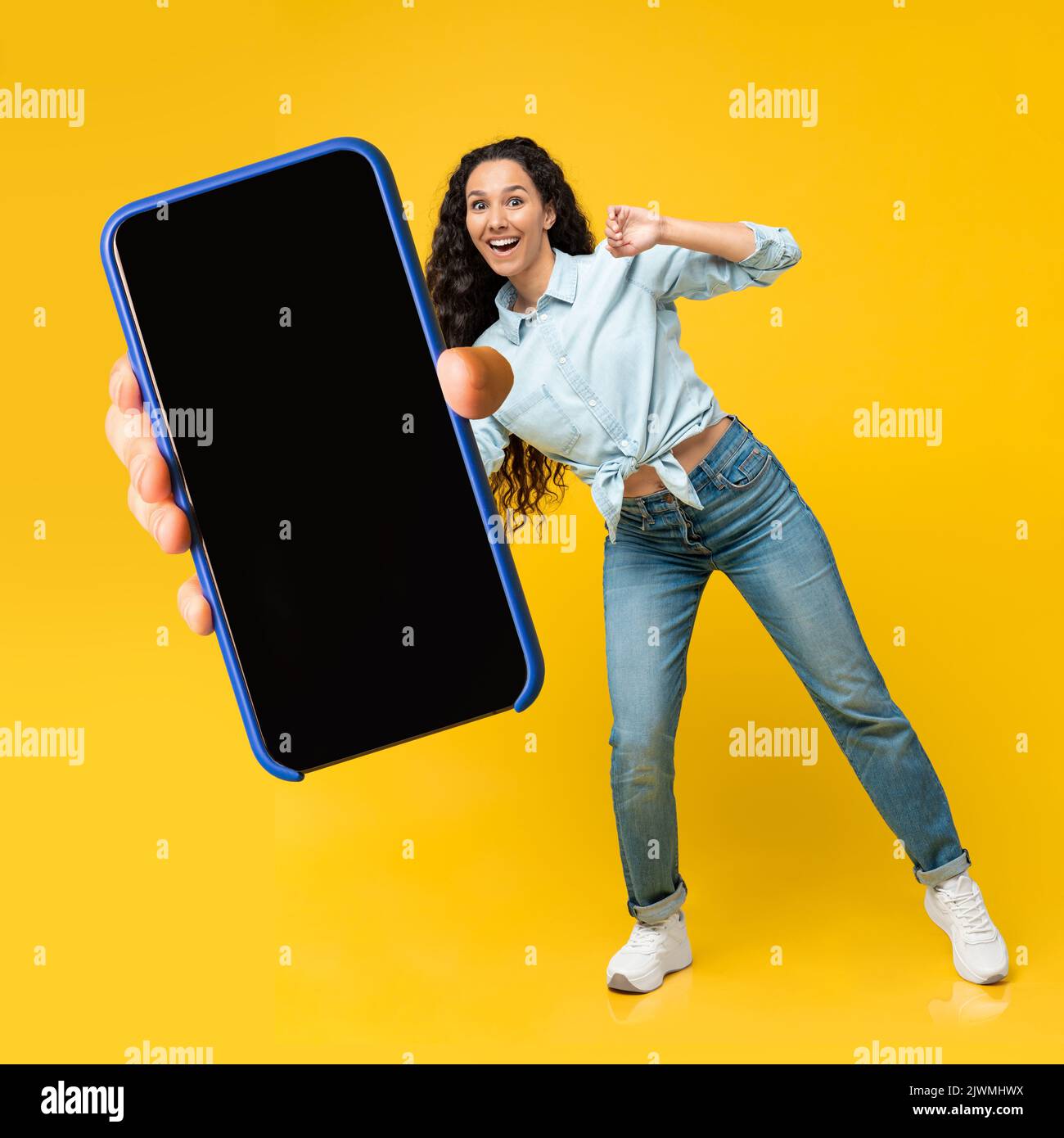 Arabic Lady Showing Big Smartphone Blank Screen On Yellow Background ...