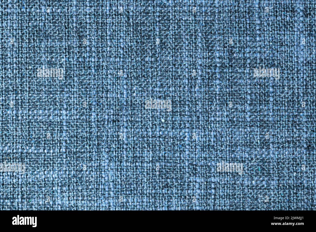 Close-up texture of natural blue coarse weave fabric or cloth. Fabric texture of natural cotton ...