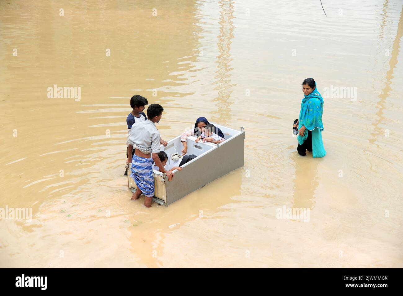 Bangalore, India. 6th Sep, 2022. Stranded people use a broken ...