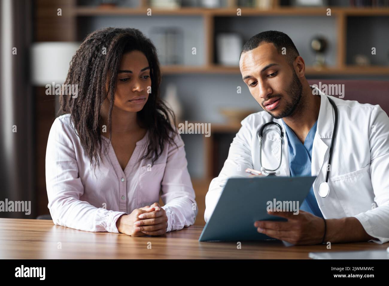 Female young patient visiting doctor hi-res stock photography and ...