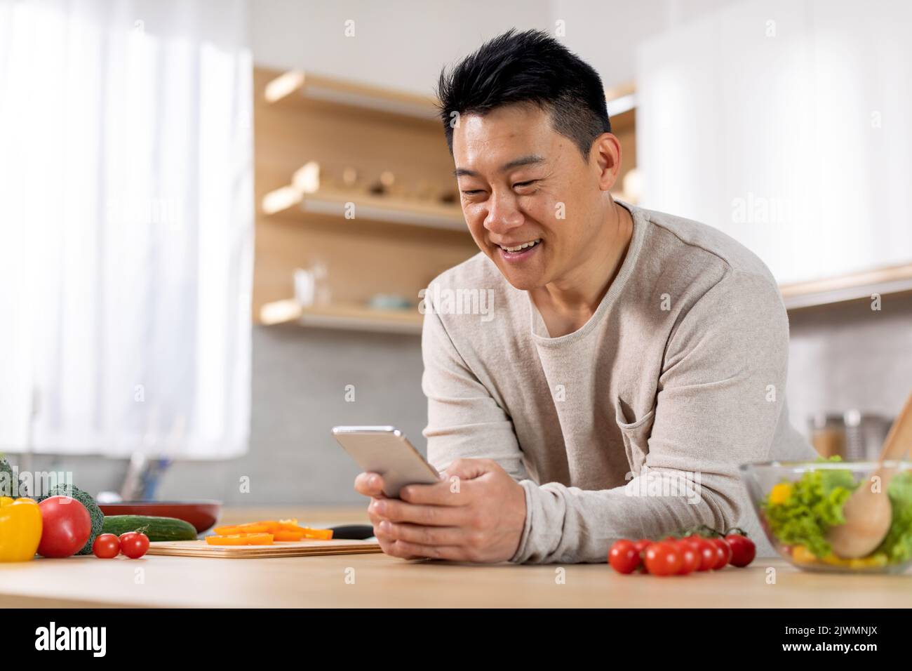 Positive asian man hi-res stock photography and images - Alamy