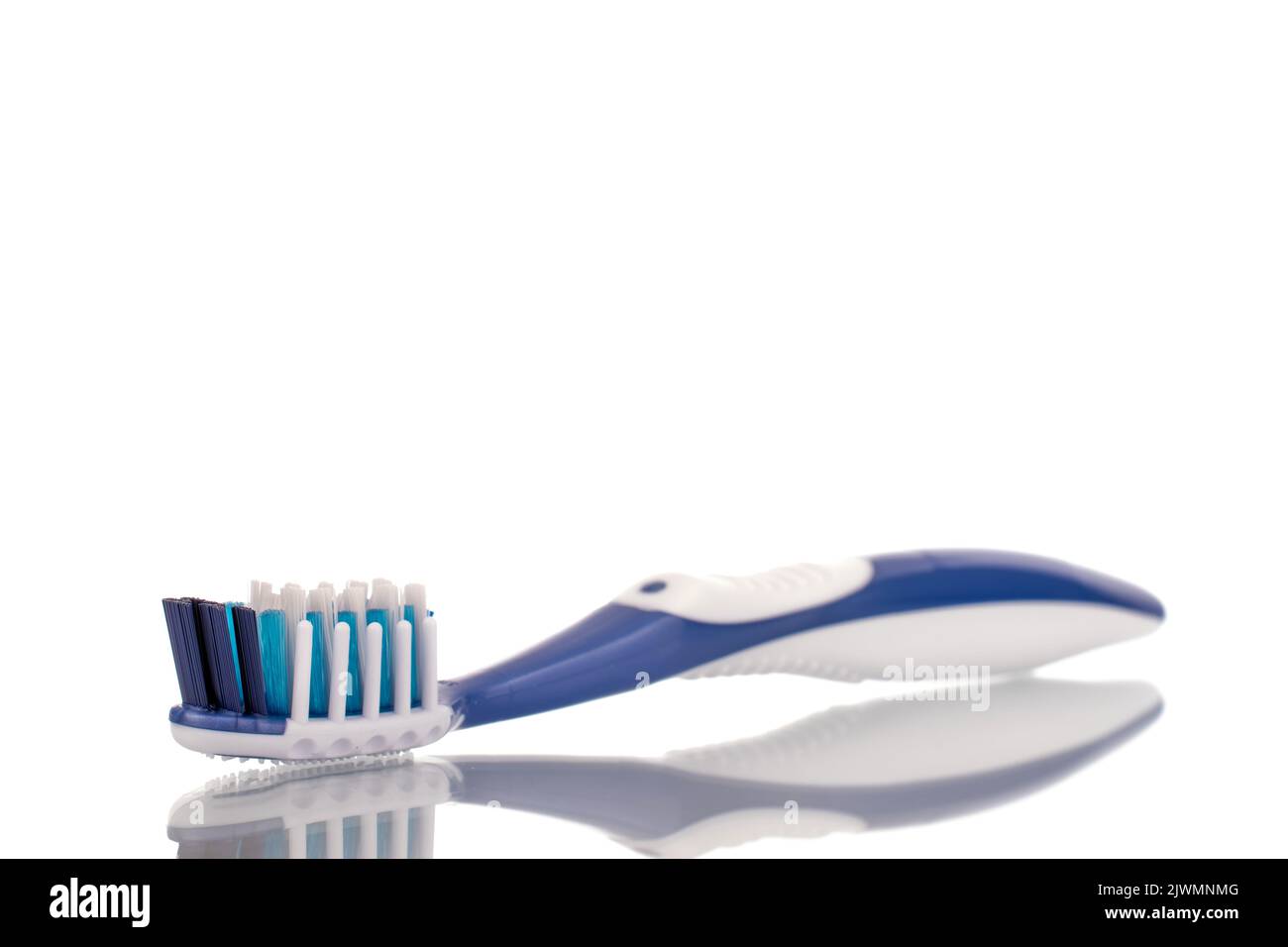 One plastic toothbrush, close-up, isolated on a white background Stock ...