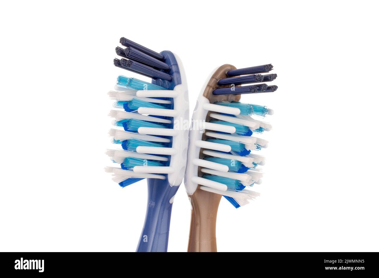 Two plastic toothbrushes, close-up, isolated on a white background ...