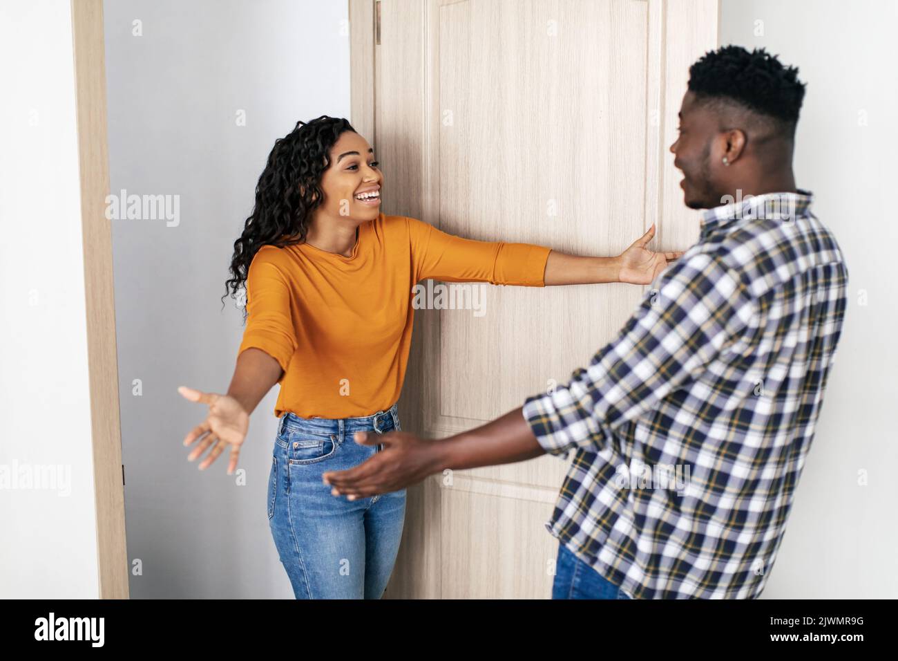 African Woman And Man Stretching Hands For Hug Meeting Indoors Stock ...