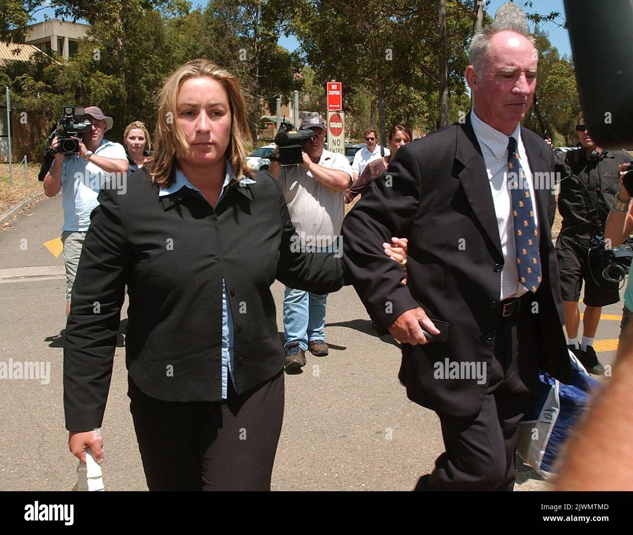 Keli Lane (left) is escorted by her father Bob Lane as they leave ...