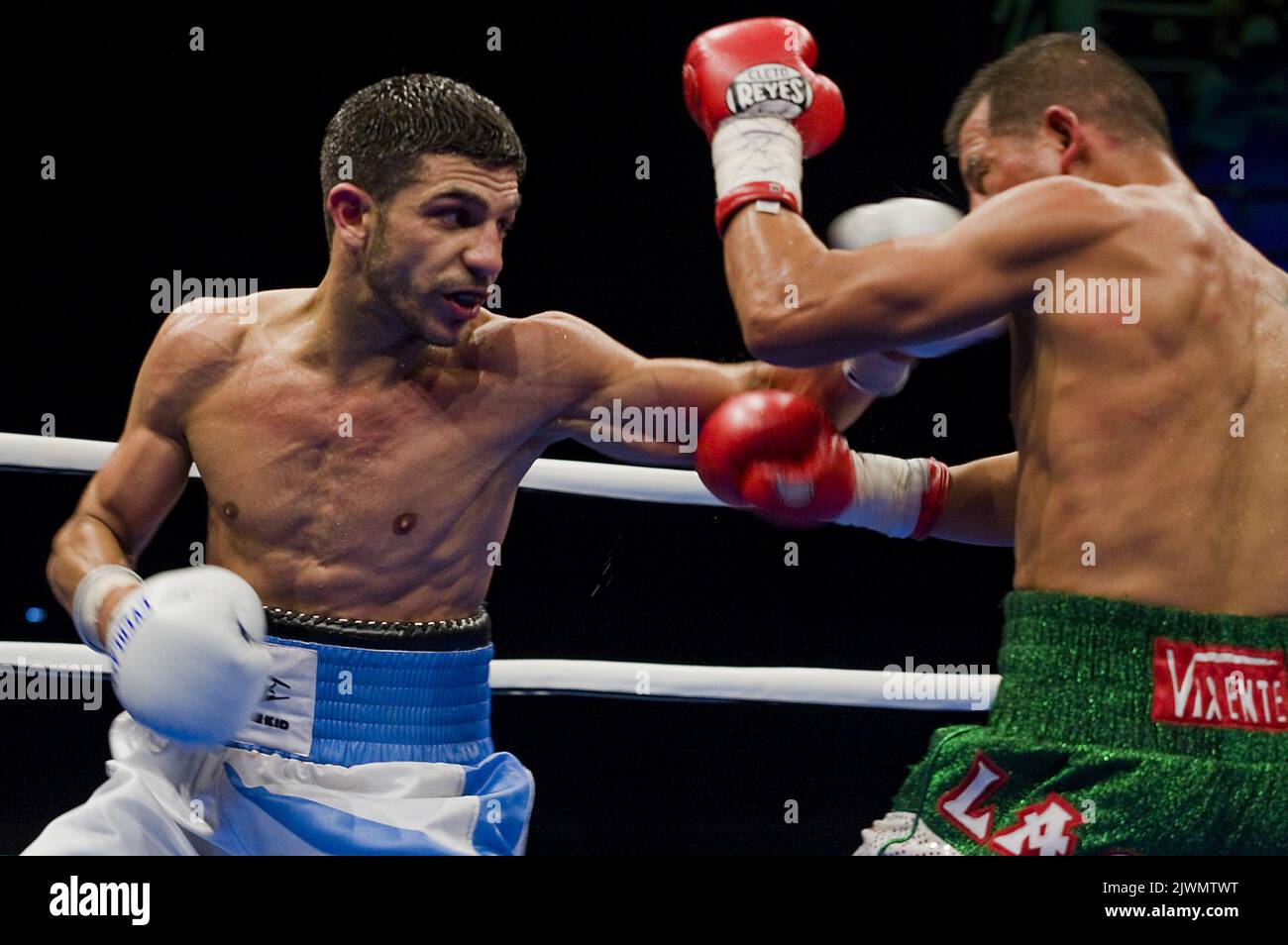 Australian Featherweight boxer (blue trunks) Billy Dib lands a left ...