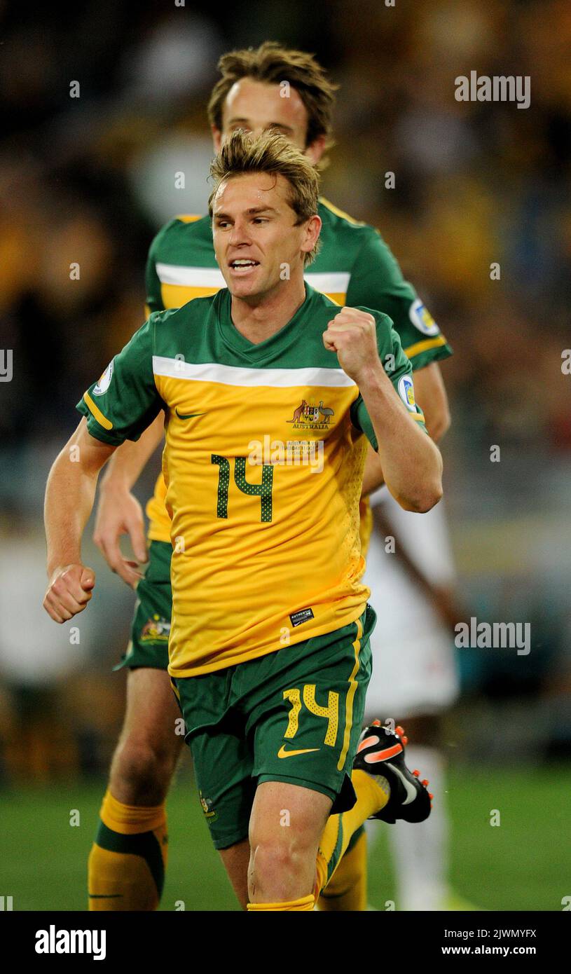Australia's Brett Holman celebrates his goal against Oman during their ...
