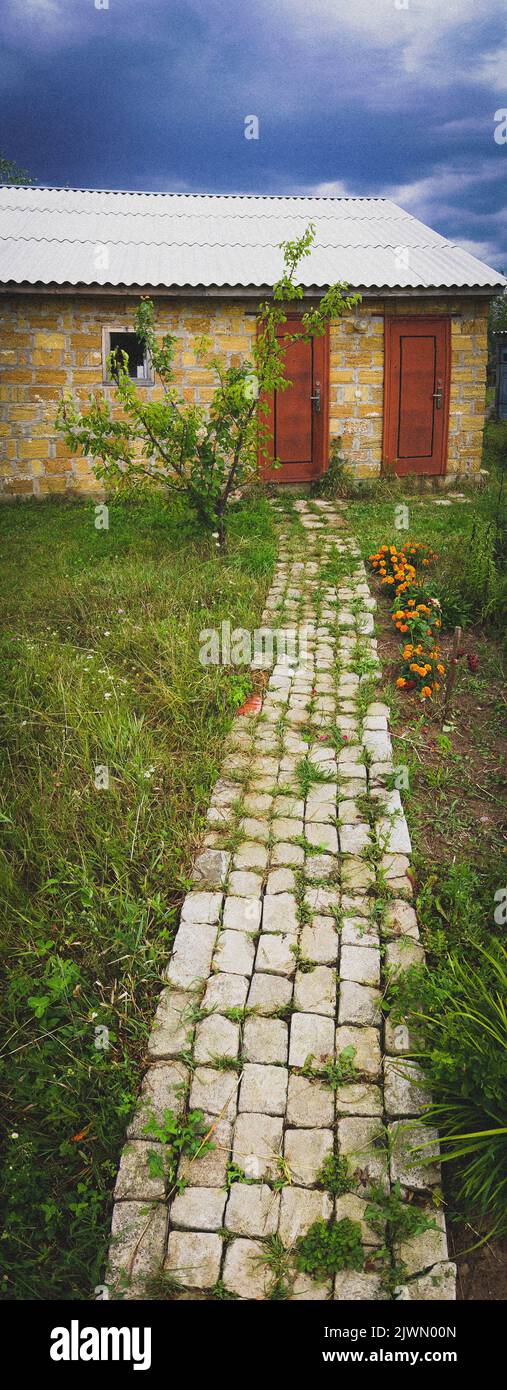 House with garage path hi-res stock photography and images - Alamy