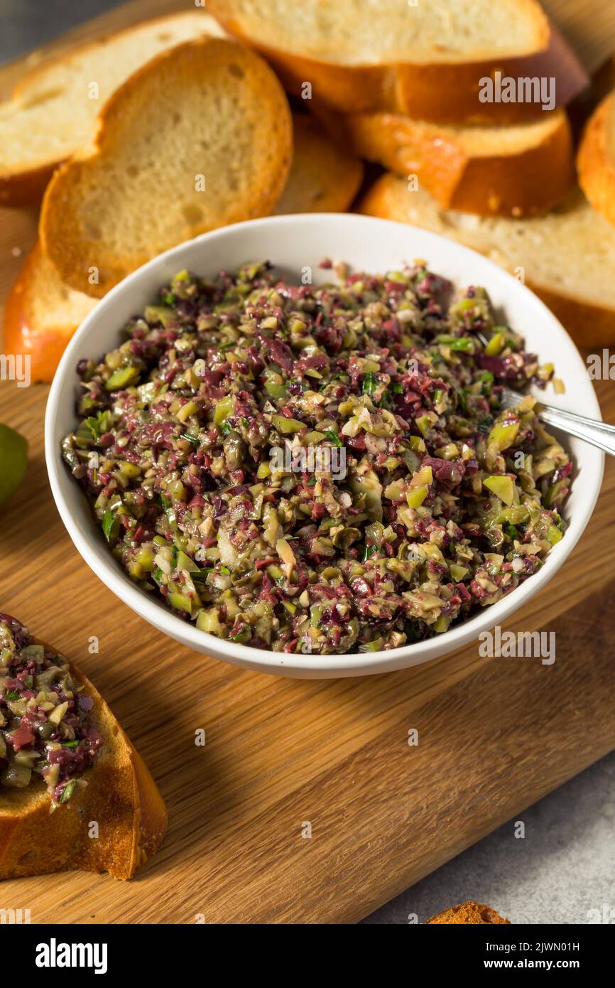 Homemade Mixed Olive Tapenade Appetizer with Toasted Bread Stock Photo ...