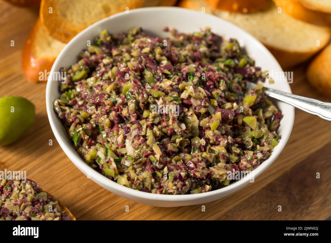 Homemade Mixed Olive Tapenade Appetizer with Toasted Bread Stock Photo ...