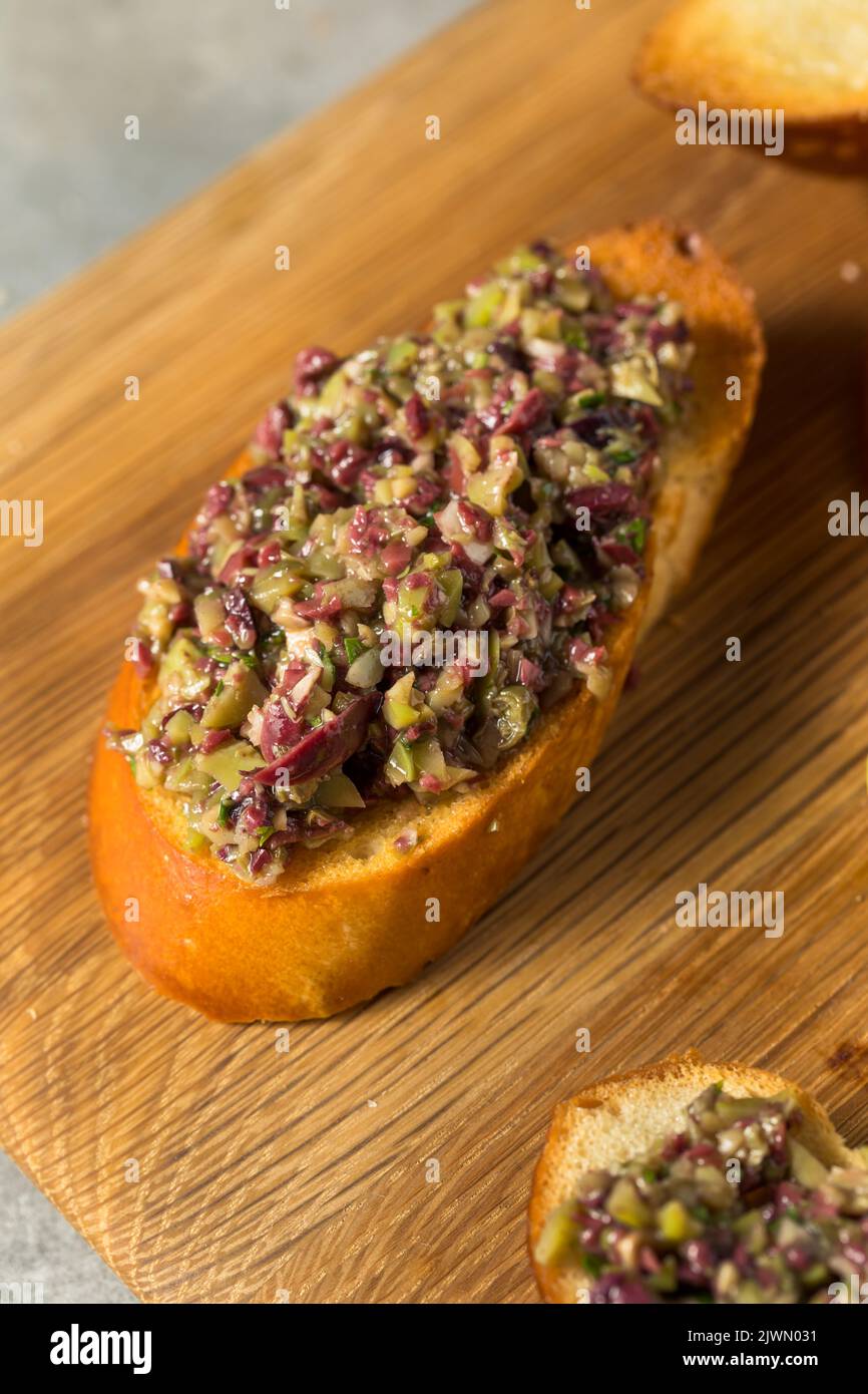 Homemade Mixed Olive Tapenade Appetizer with Toasted Bread Stock Photo ...