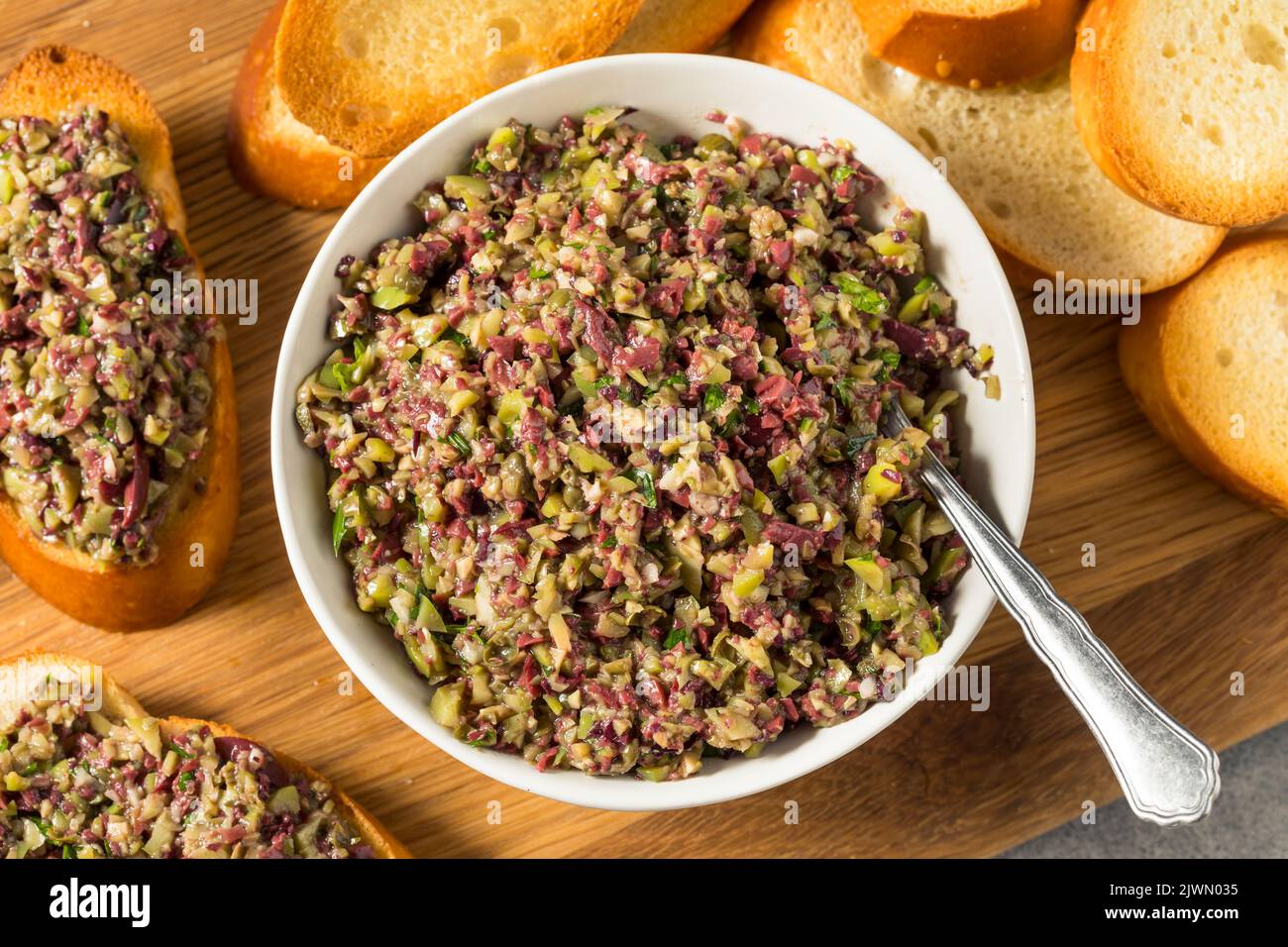Homemade Mixed Olive Tapenade Appetizer with Toasted Bread Stock Photo ...