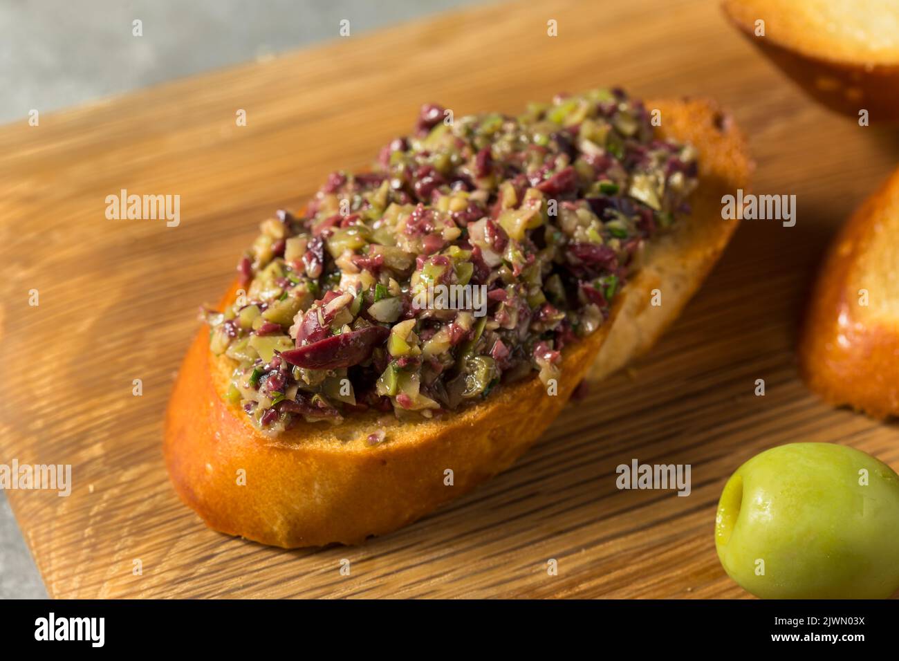 Homemade Mixed Olive Tapenade Appetizer with Toasted Bread Stock Photo ...
