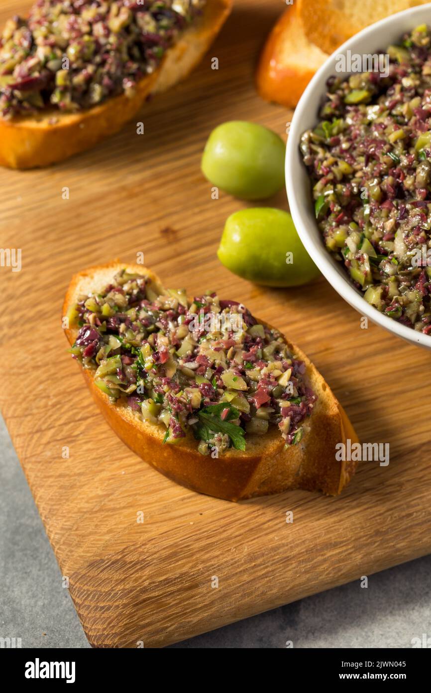 Homemade Mixed Olive Tapenade Appetizer with Toasted Bread Stock Photo ...
