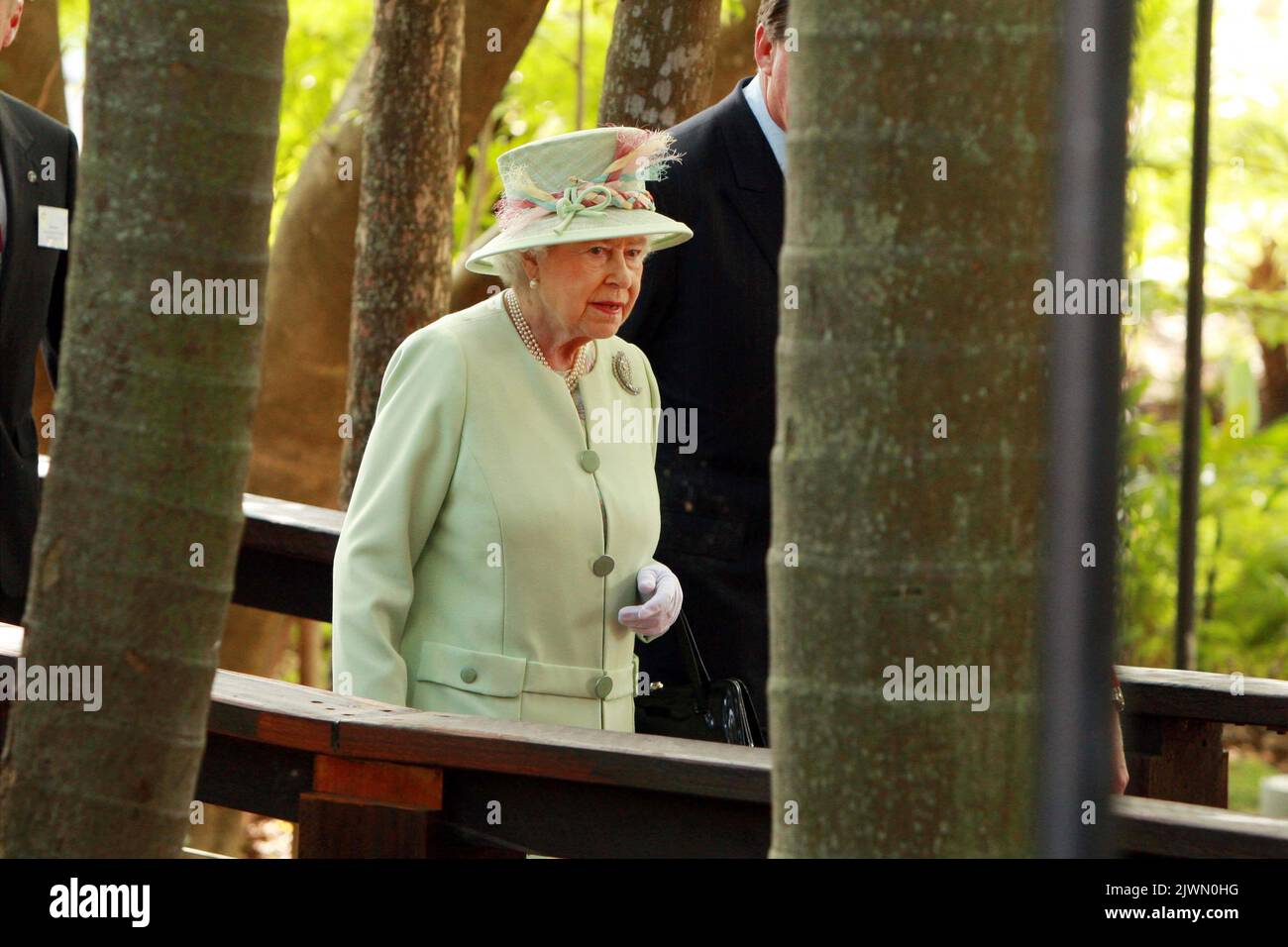 Her Majesty Queen Elizabeth II walks through a rainforest as she tours ...