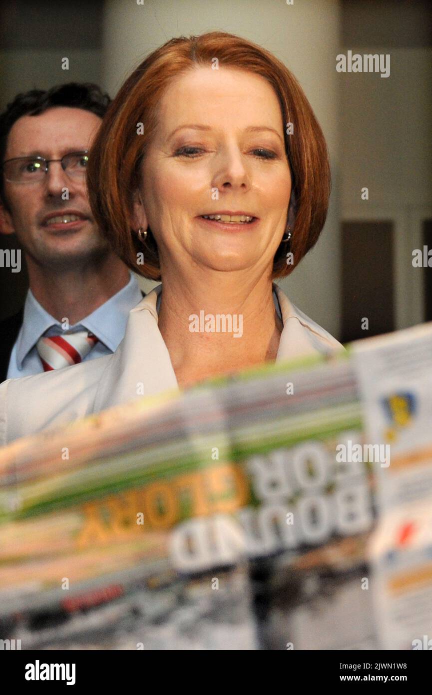Prime Minister Julia Gillard checks the race guide before the Melbourne ...