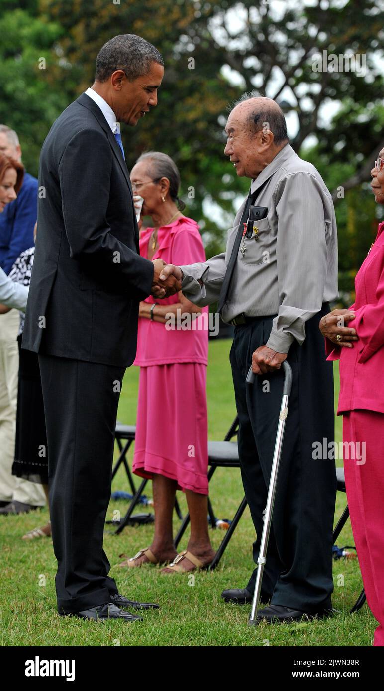 US President Barack Obama talks with Riley Wing (right) after laying a ...