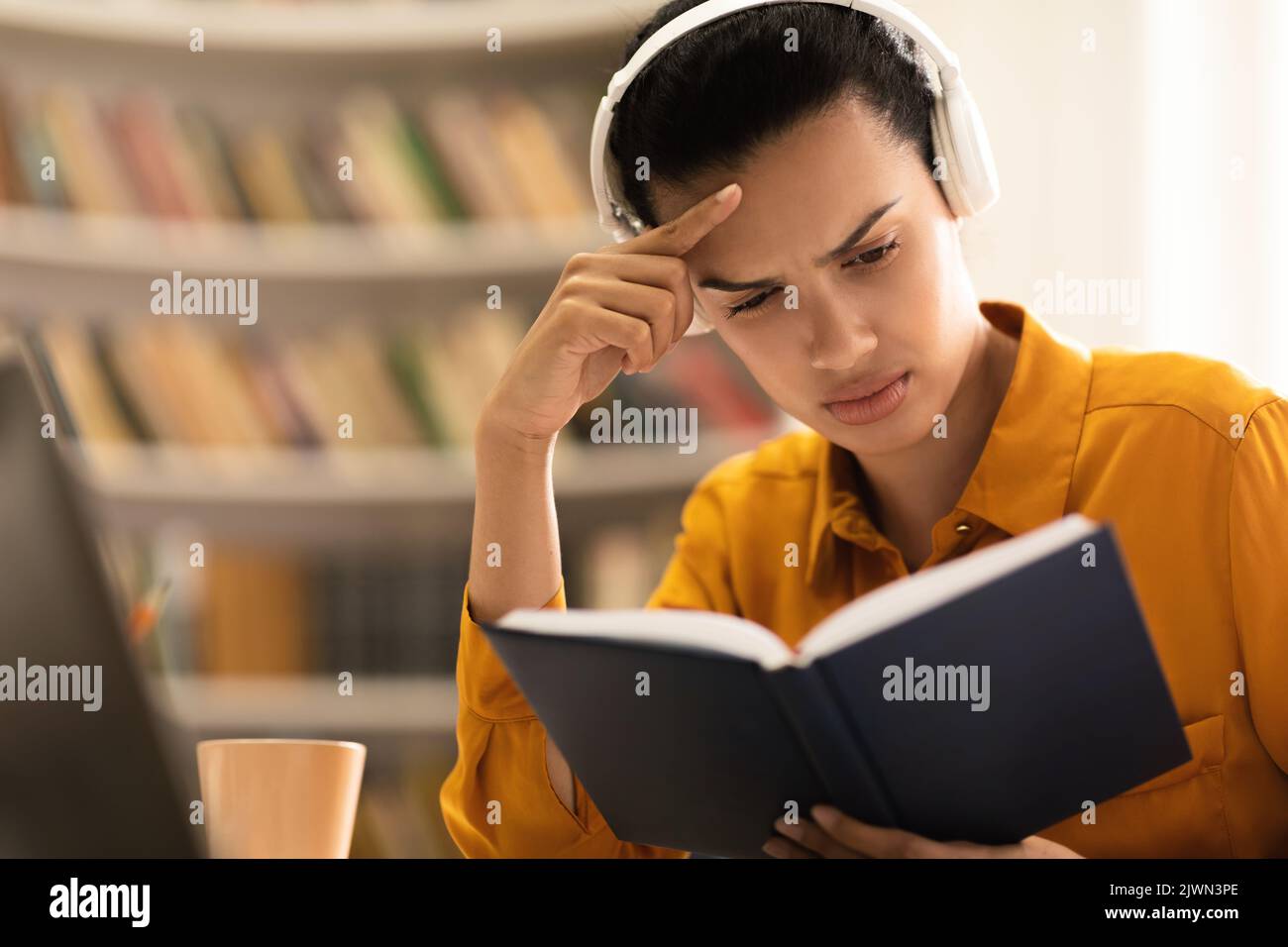 Student woman watching paper book hi-res stock photography and images ...