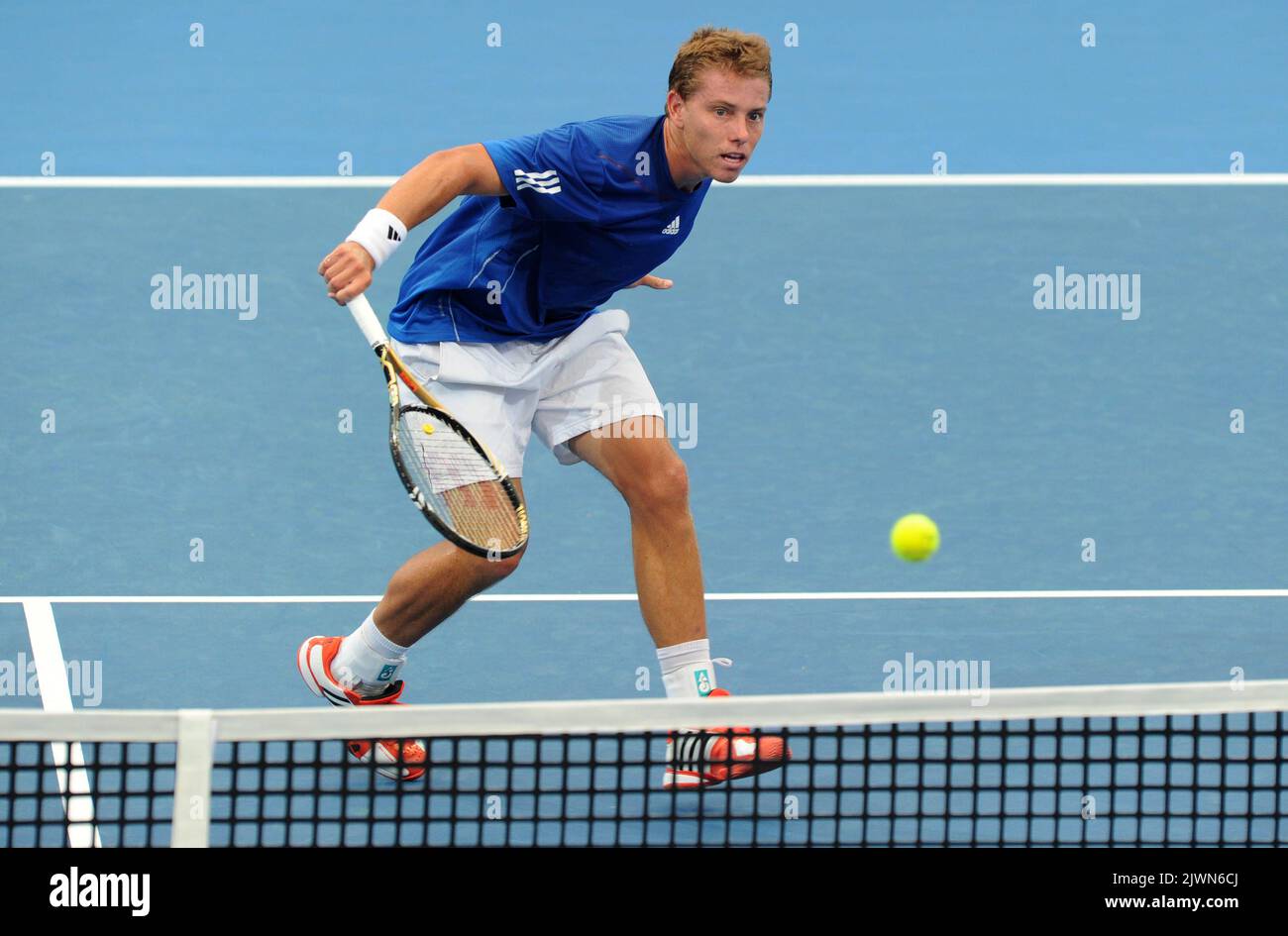 Australian James Duckwoth volleys at the net during his second round ...