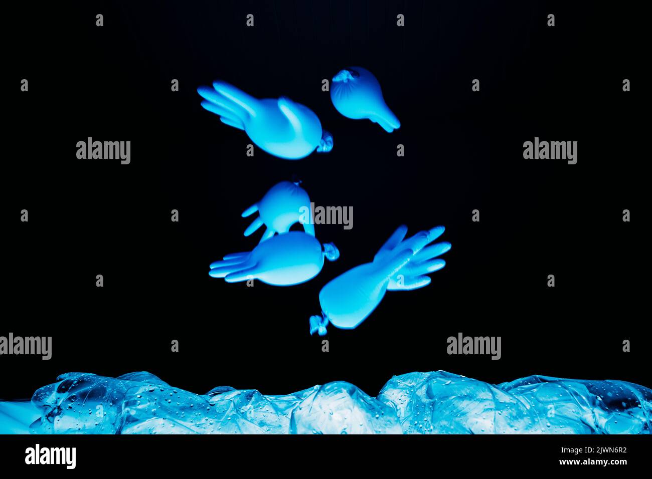 environmental pollution blue gloves polyethylene Stock Photo - Alamy