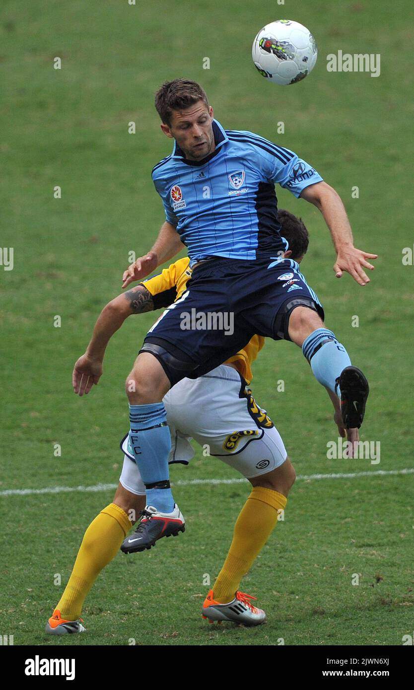 Sydney FC's Shannon Cole (front) competes for the ball with Troy ...
