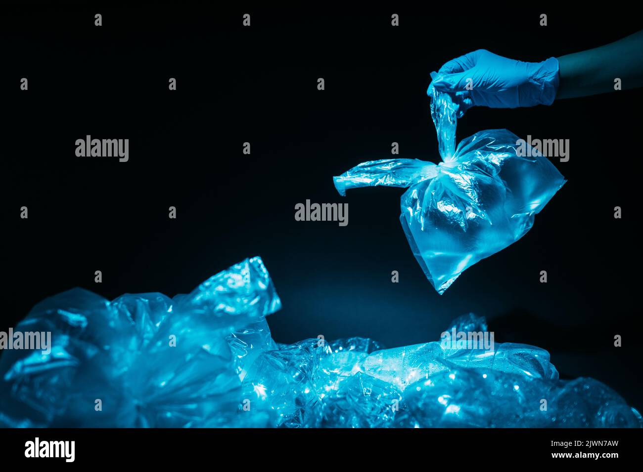 waste reduction plastic pollution volunteer hand Stock Photo - Alamy