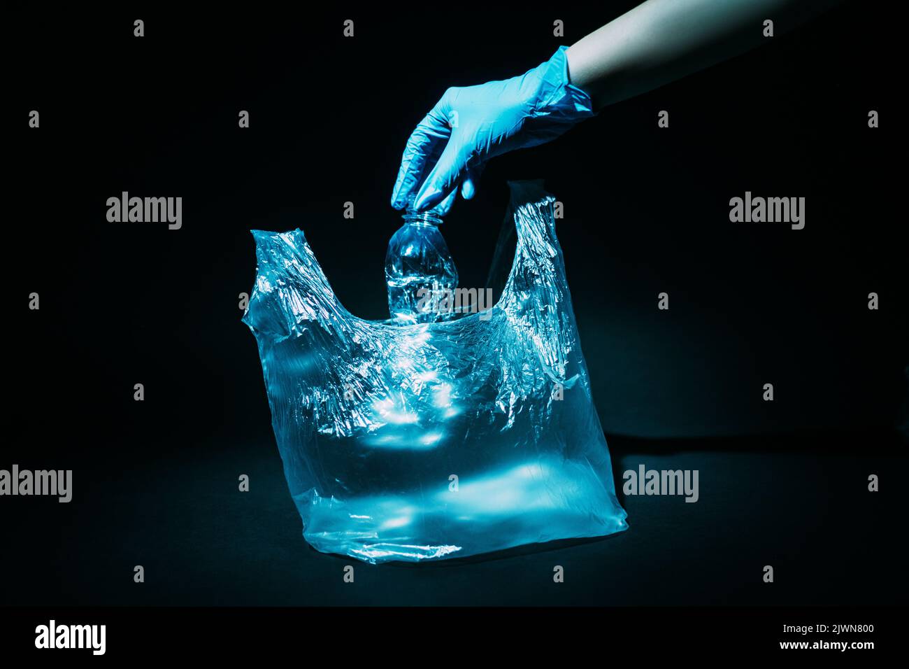 Litter isolated plastic bag hand hi-res stock photography and images ...
