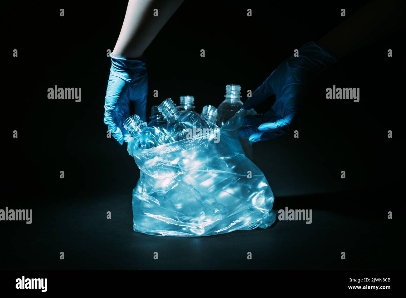 waste collection plastic recycling hands bottles Stock Photo - Alamy