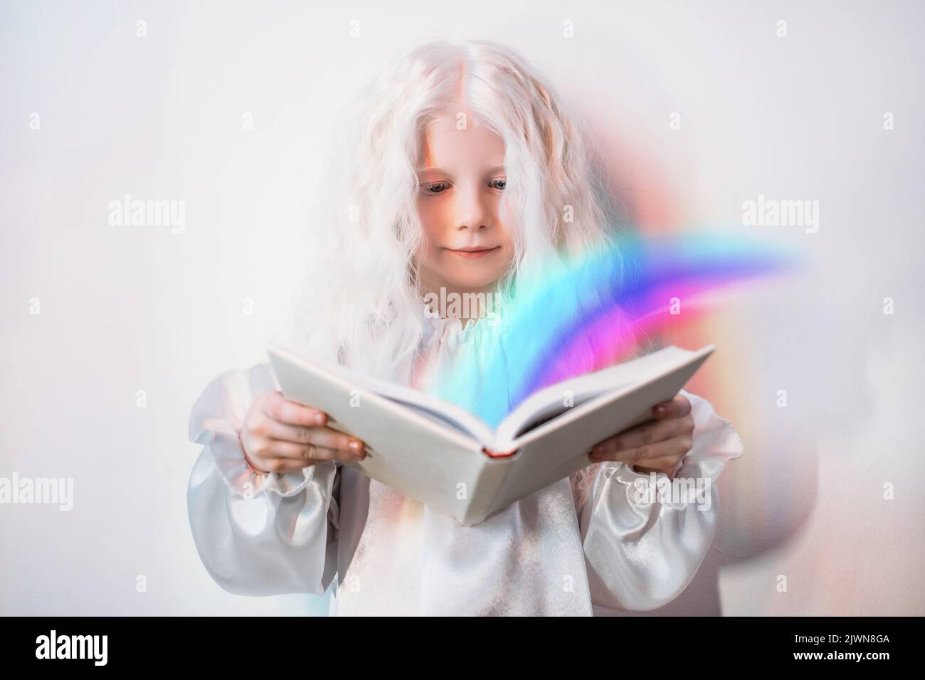 child imagination story time girl rainbow book Stock Photo - Alamy