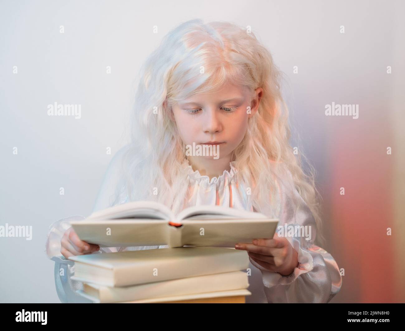 child education reading hobby blonde girl book Stock Photo - Alamy
