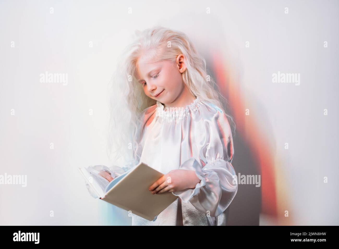 child hobby kid leisure blonde girl reading book Stock Photo - Alamy