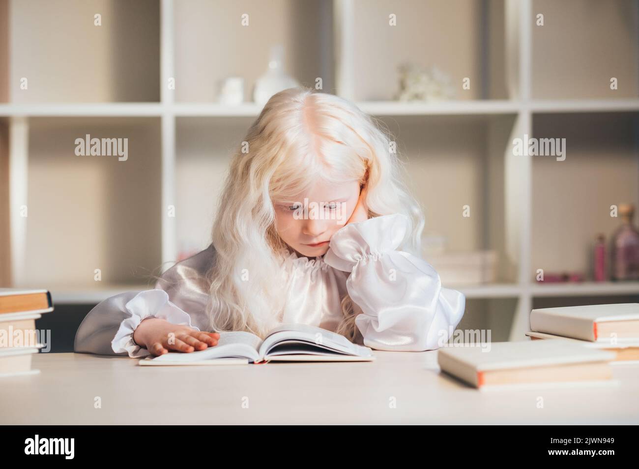 home education child development girl reading book Stock Photo - Alamy