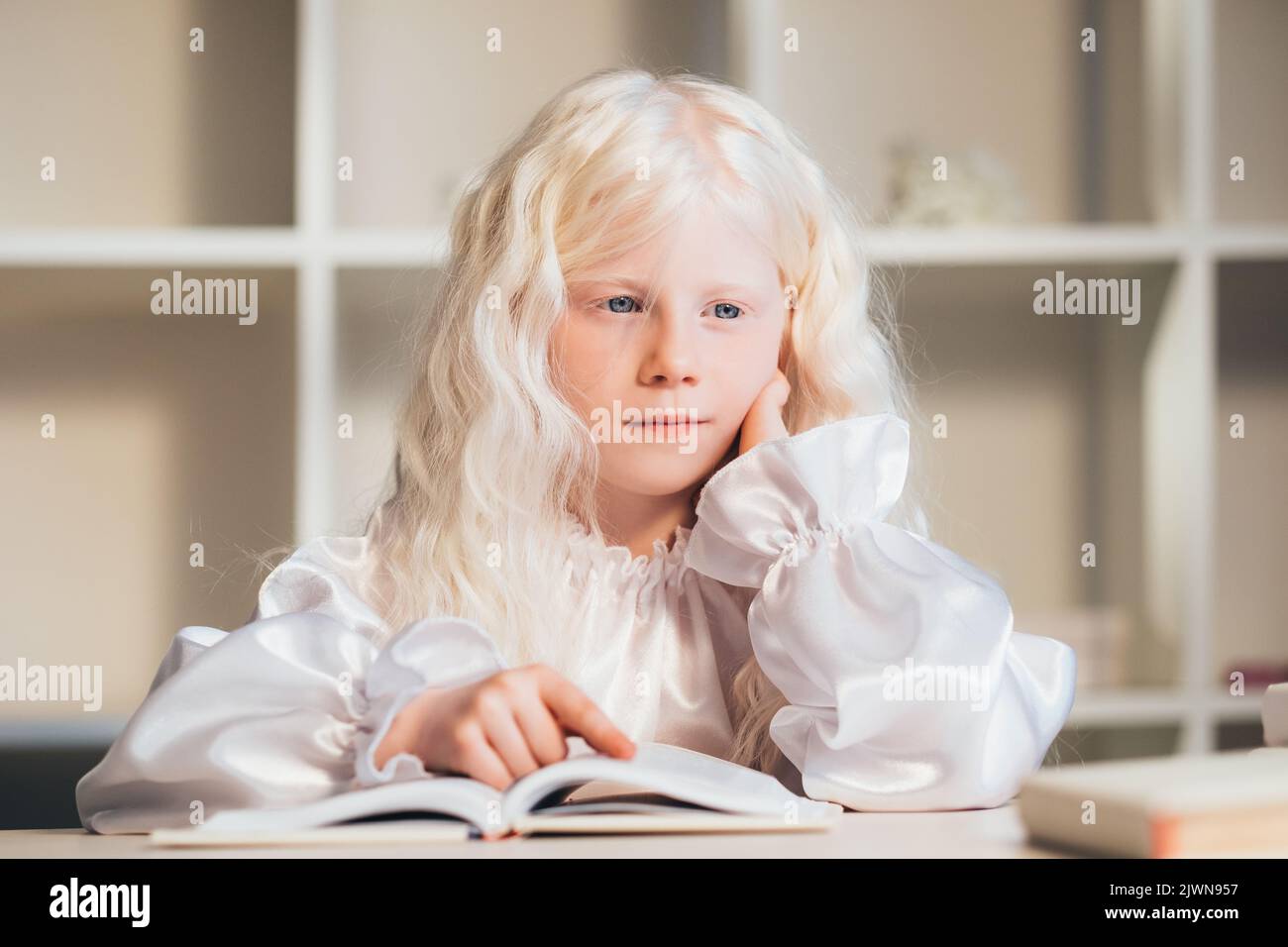 child leisure reading hobby daydreaming girl book Stock Photo - Alamy
