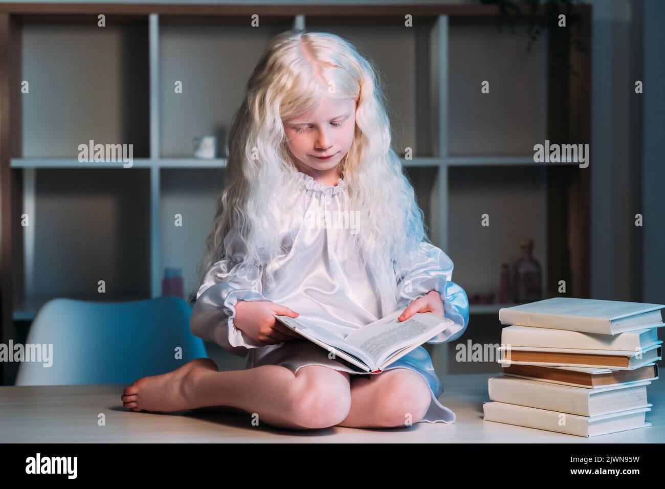 child education reading hobby blonde girl book Stock Photo - Alamy