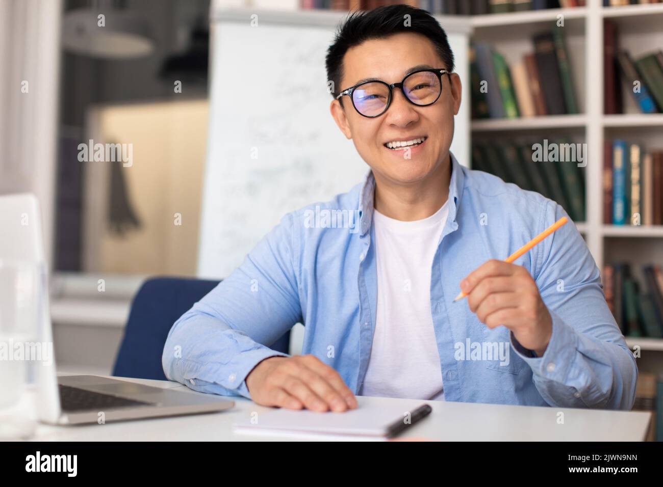 Happy Korean Tutor Man Taking Notes Having Online Class Indoor Stock ...