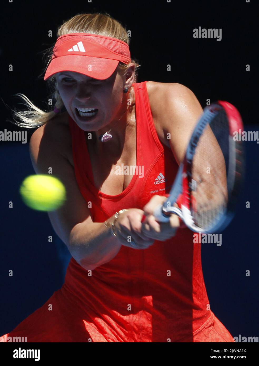 Caroline Wozniacki of Denmark hits a return in her women's ...