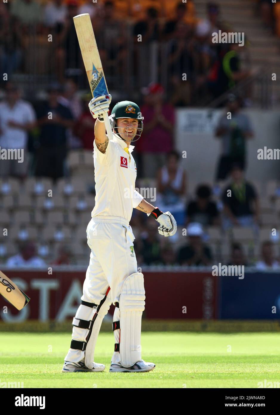 Australia's Michael Clarke raises his bat on the second day of the ...
