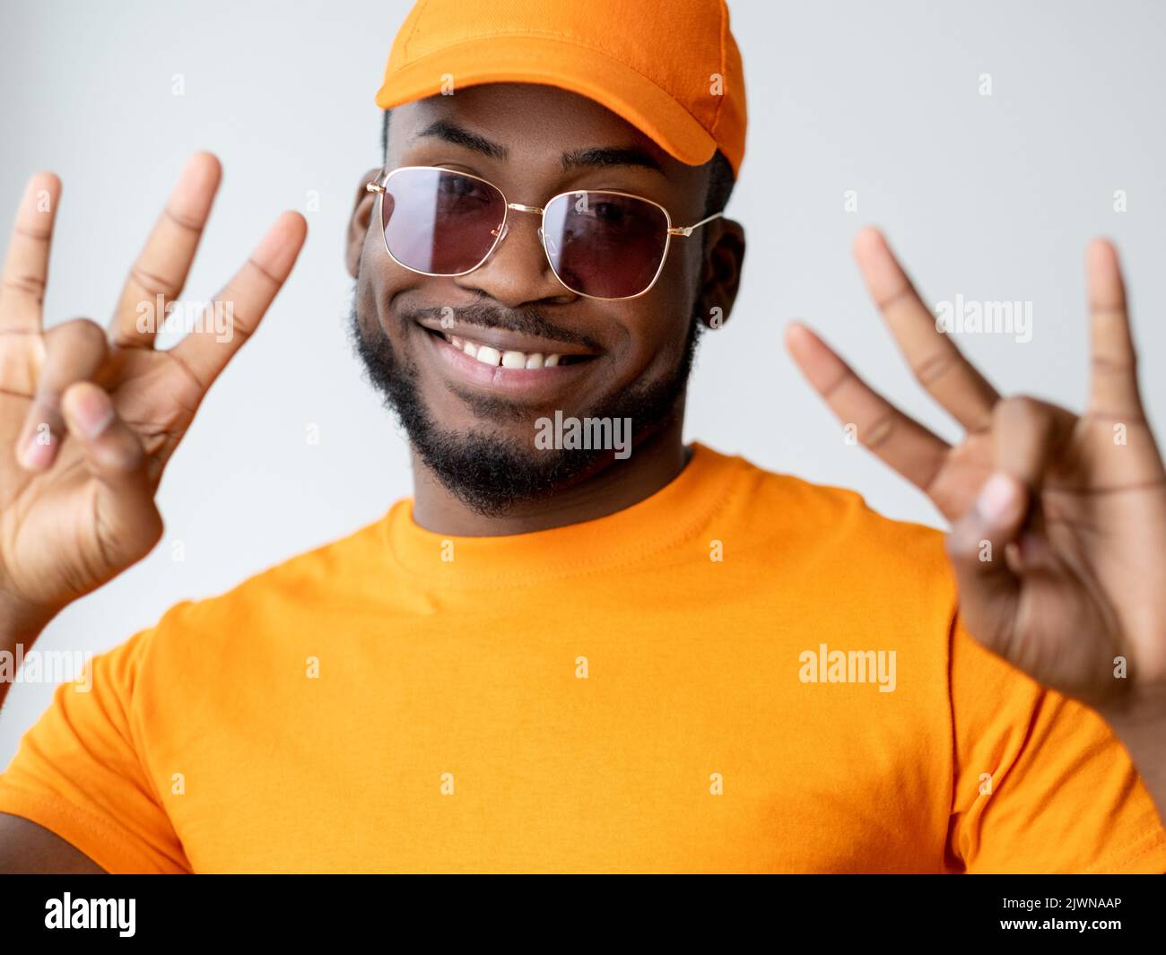Fashion male model wearing orange t shirt hi-res stock photography and ...