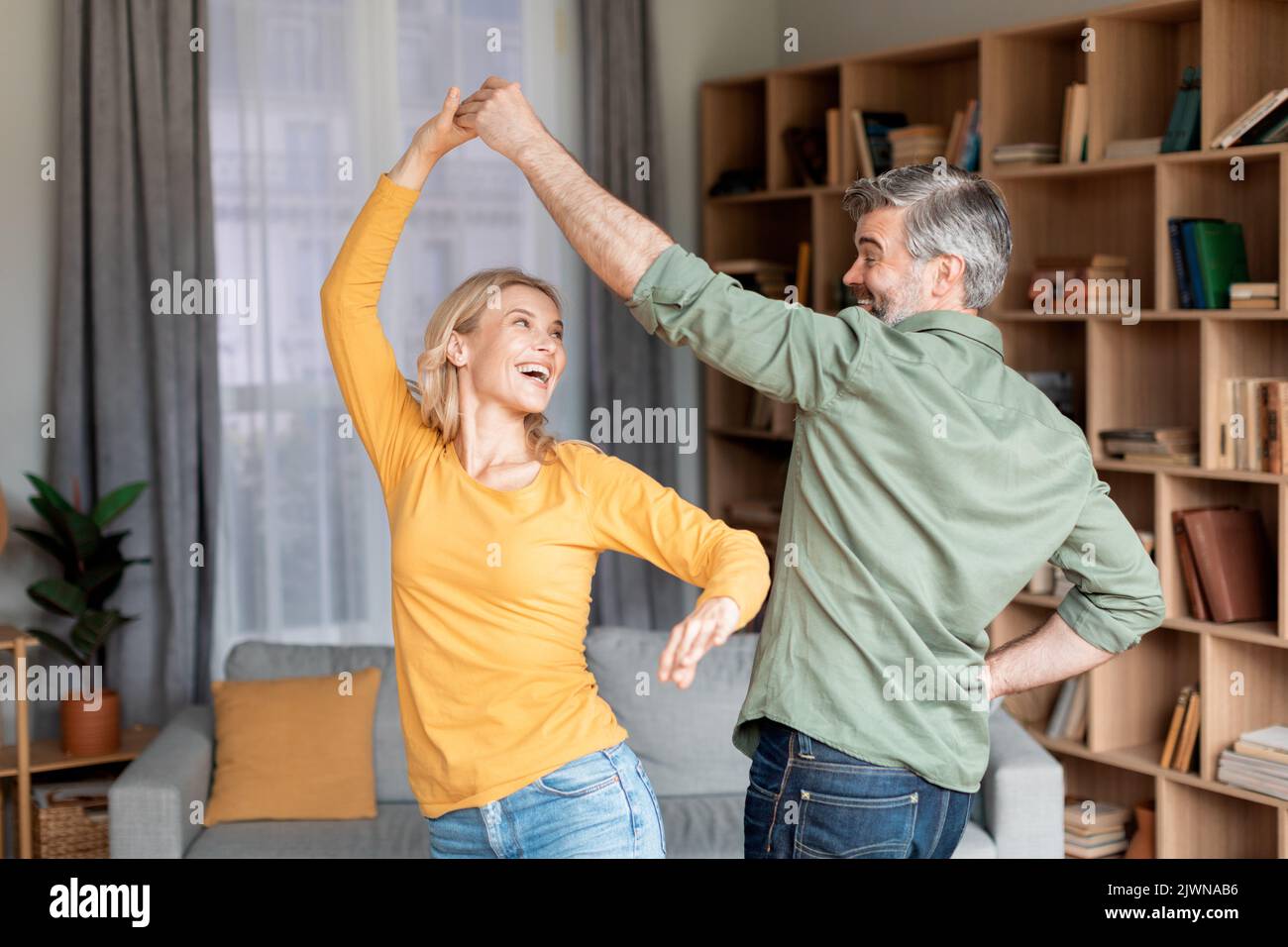 Joyful middle aged woman dancing hi-res stock photography and images ...