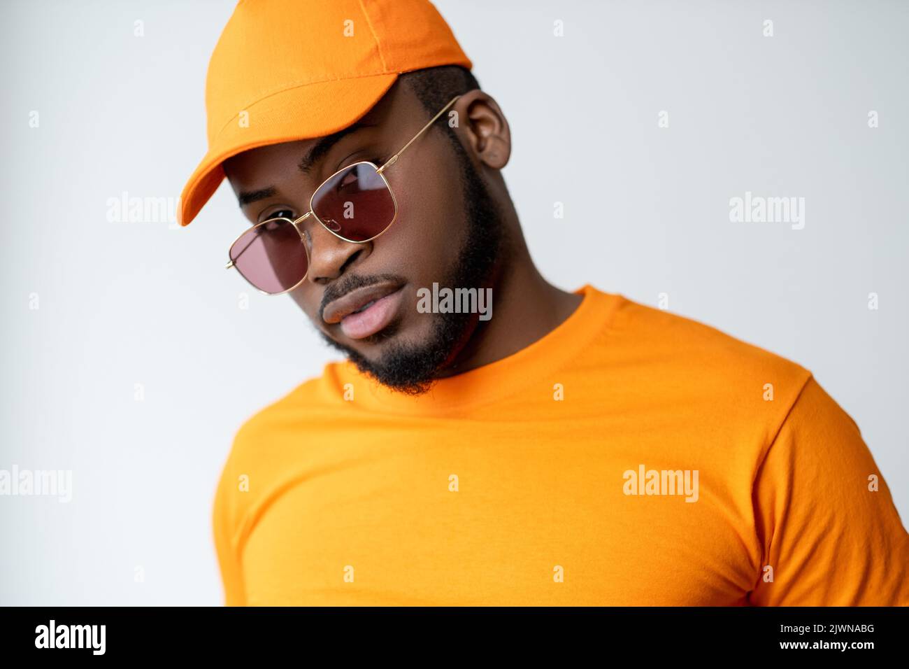 man fashion modern eyewear african model orange Stock Photo - Alamy