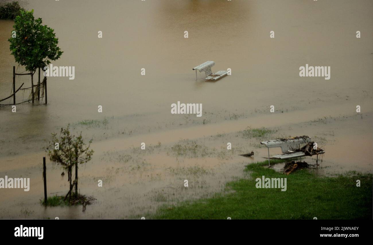 Park benches are swamped by the swollen Bellinger River at Bellinger ...