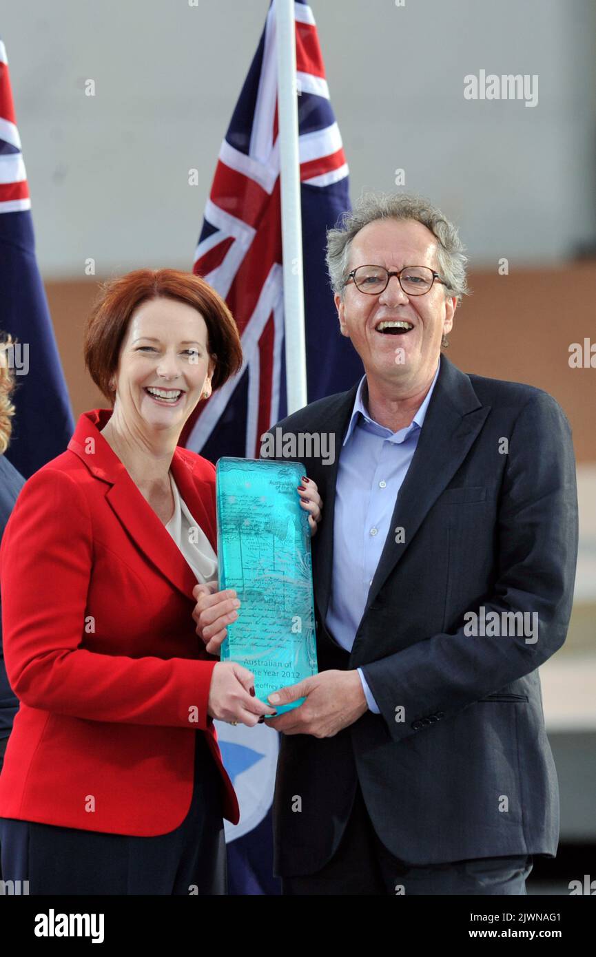 Prime Minister Julia Gillard presents actor Geoffrey Rush with his 2012 ...