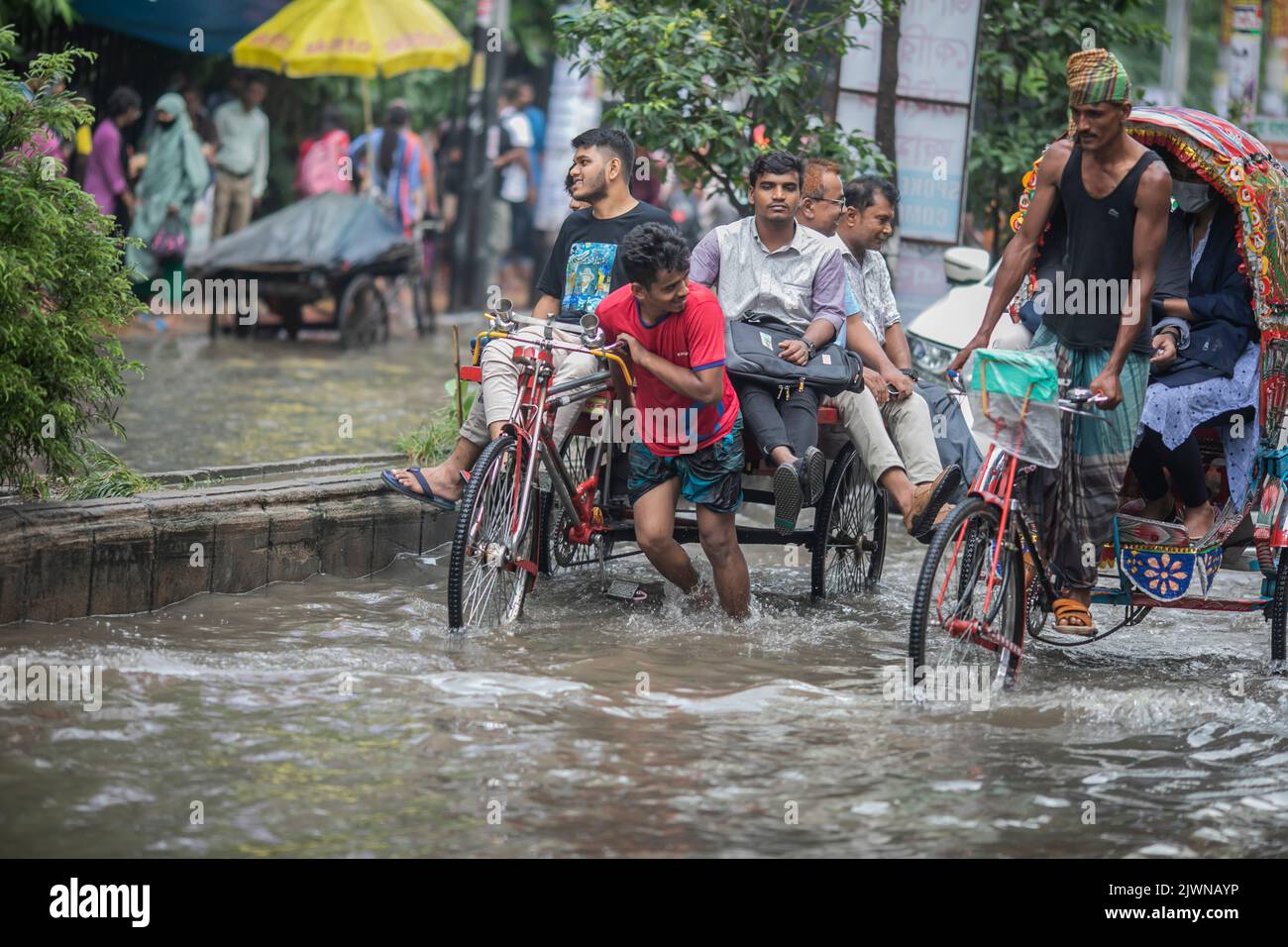Rickshaws carry passengers and tries to get them through the ...