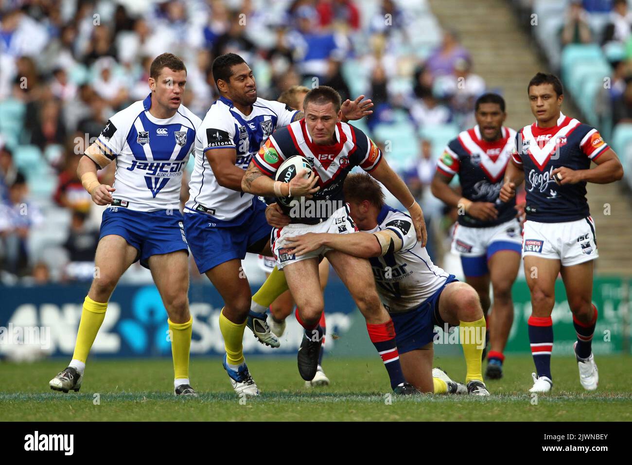 Shaun Kenny-Dowall is tackled by Mickey Paea during the NRL Round 3 ...