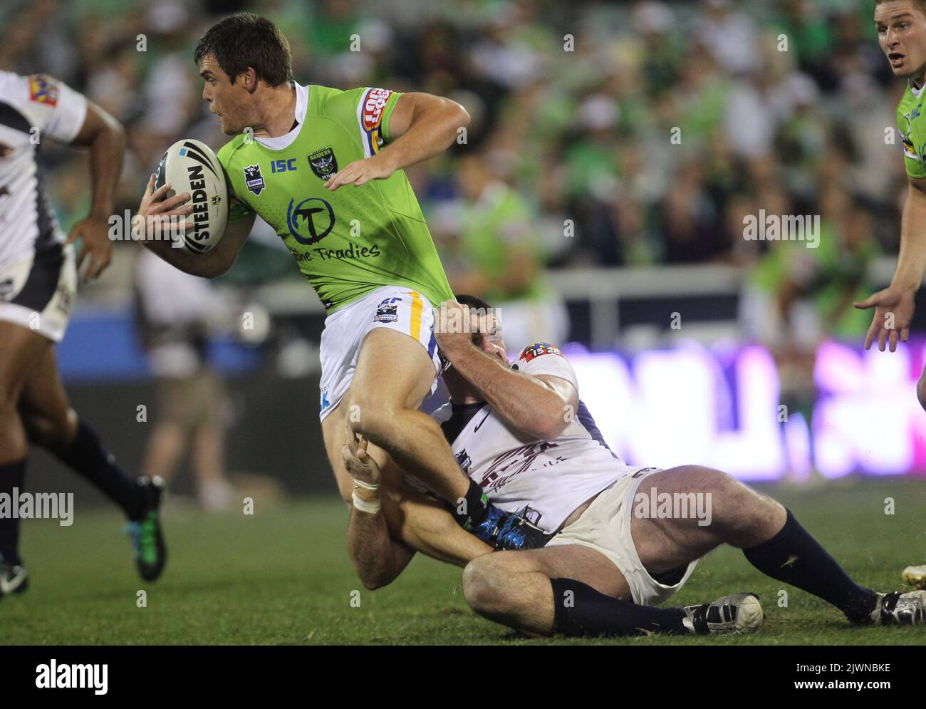 David Milne dragged down by Shane Tronc during the NRL, round 2 ...