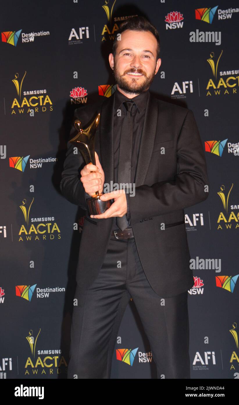 Snowtown actor Daniel Henshall poses for photographs with his award for ...