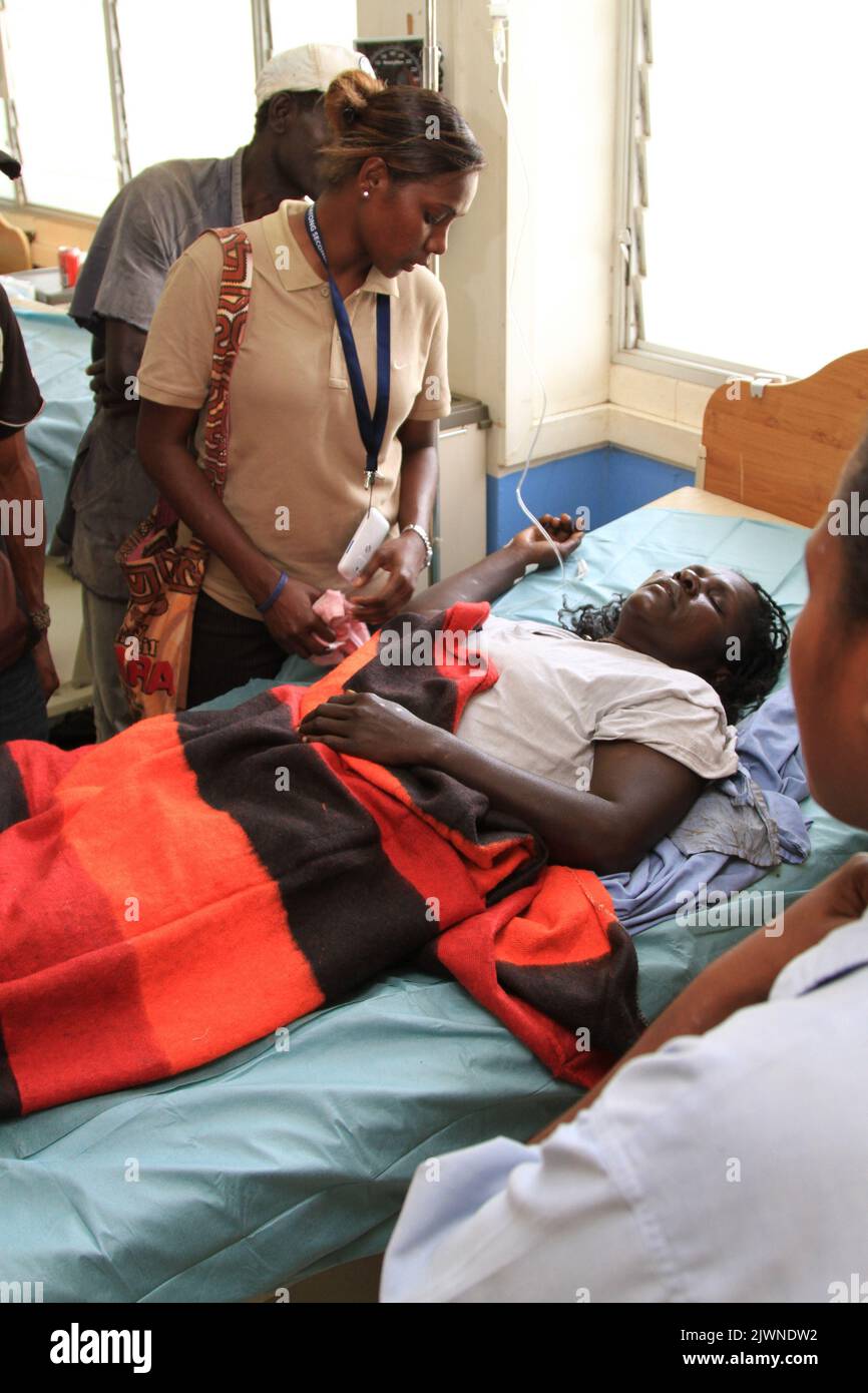 Regina Kabrette lies in bed at Lae's Angau Memorial Hospital and talks ...