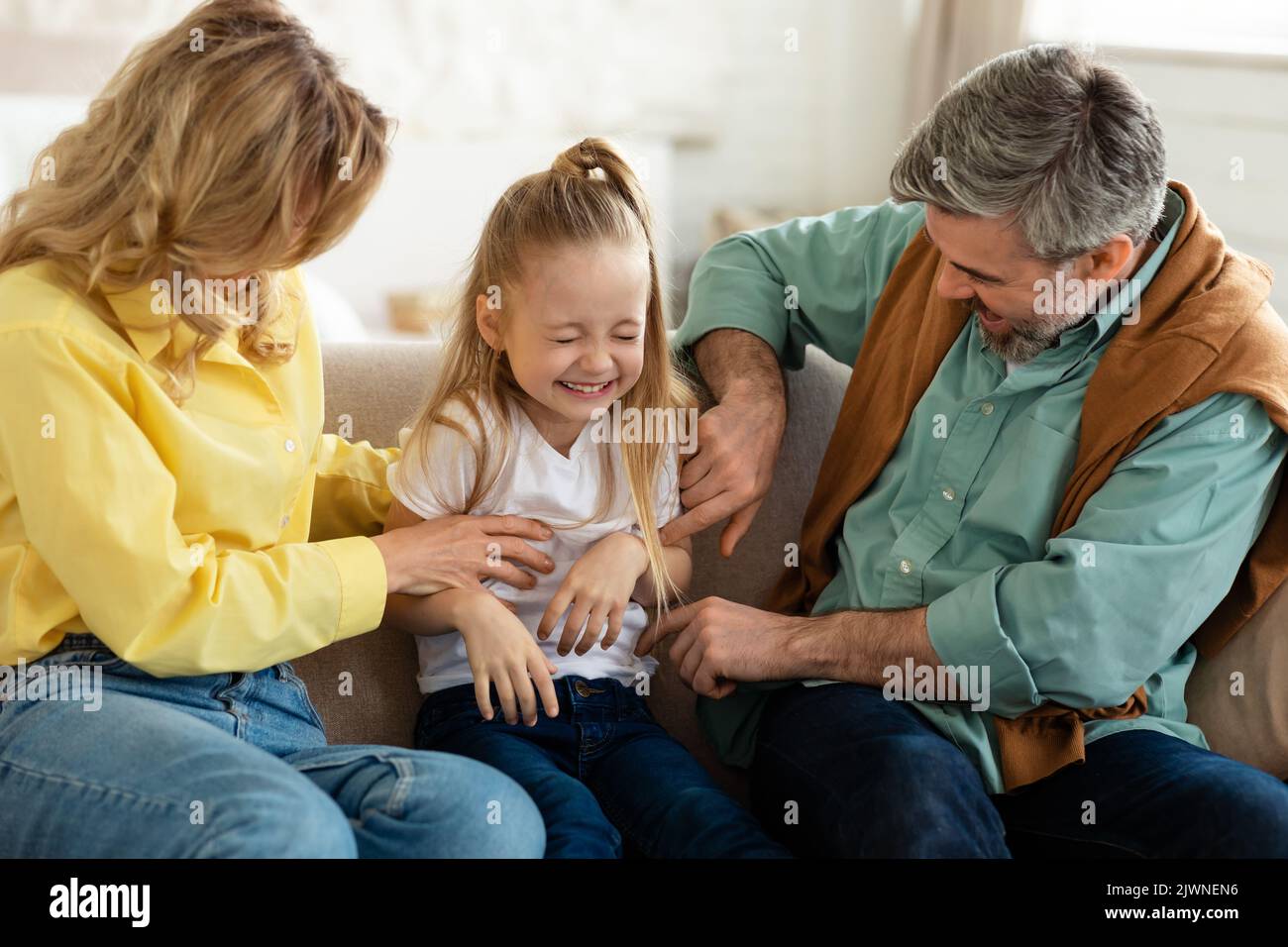 Tickling laughing hi-res stock photography and images - Alamy