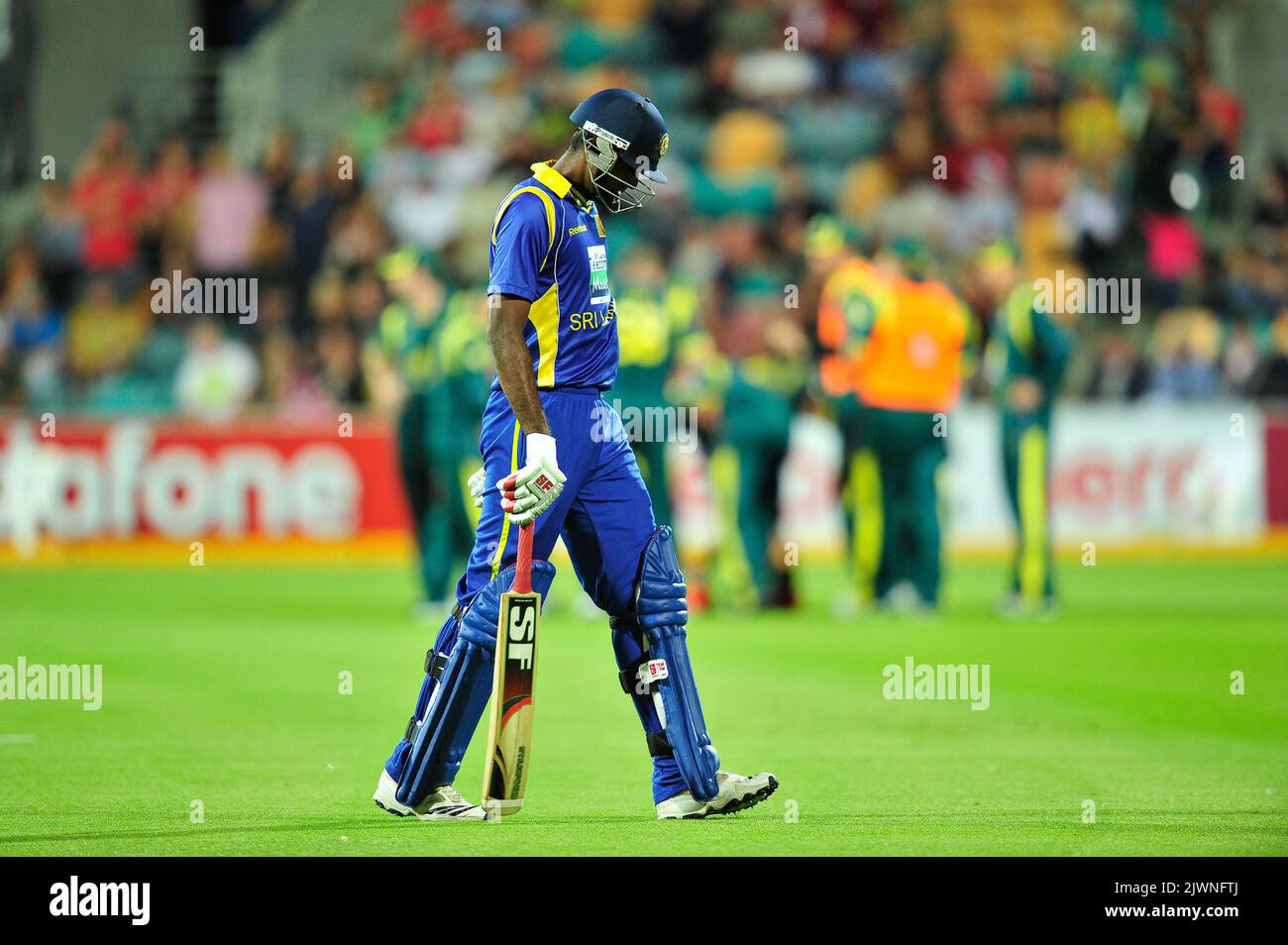 Farveez Maharoof leaves the field after being caught by Ryan Harris ...